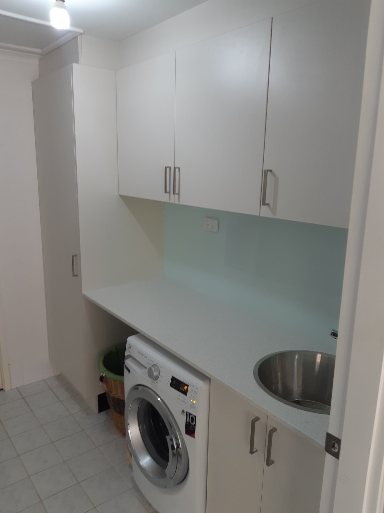 Joinery Considerations: Why Having a Pull-Out Laundry Hamper is Beneficial